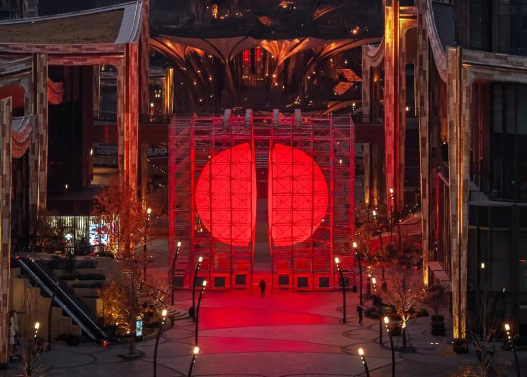 SpY presents "Divided" through a monumental sphere of red light ...